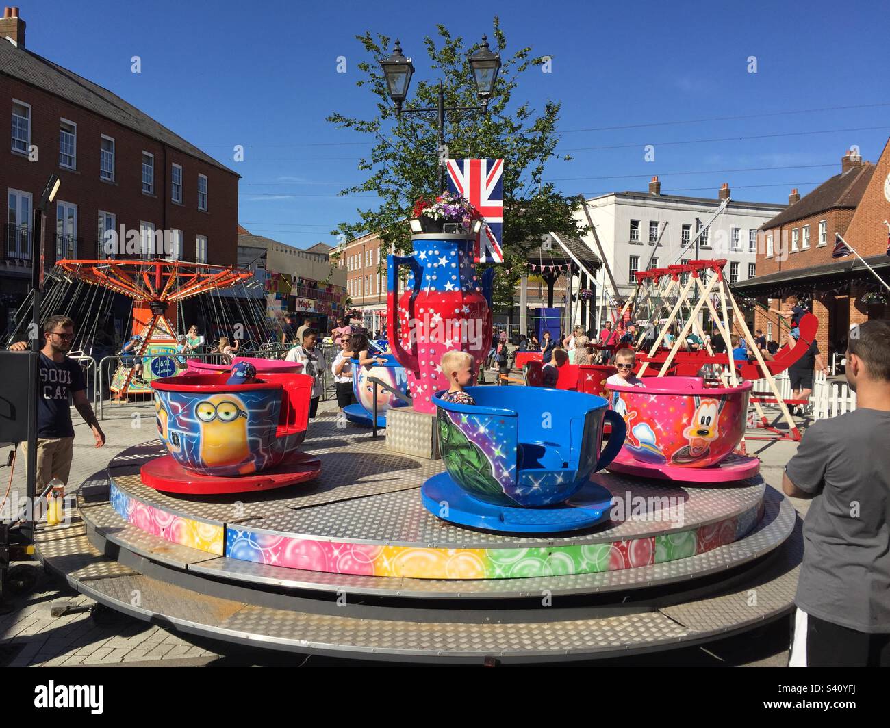 Fairground rides in the town square hi-res stock photography and images ...