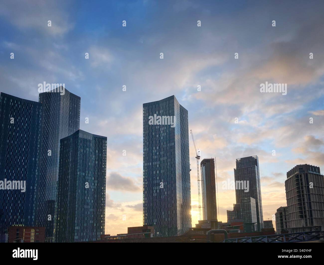 Tower blocks in Manchester with sunset sky Stock Photo - Alamy
