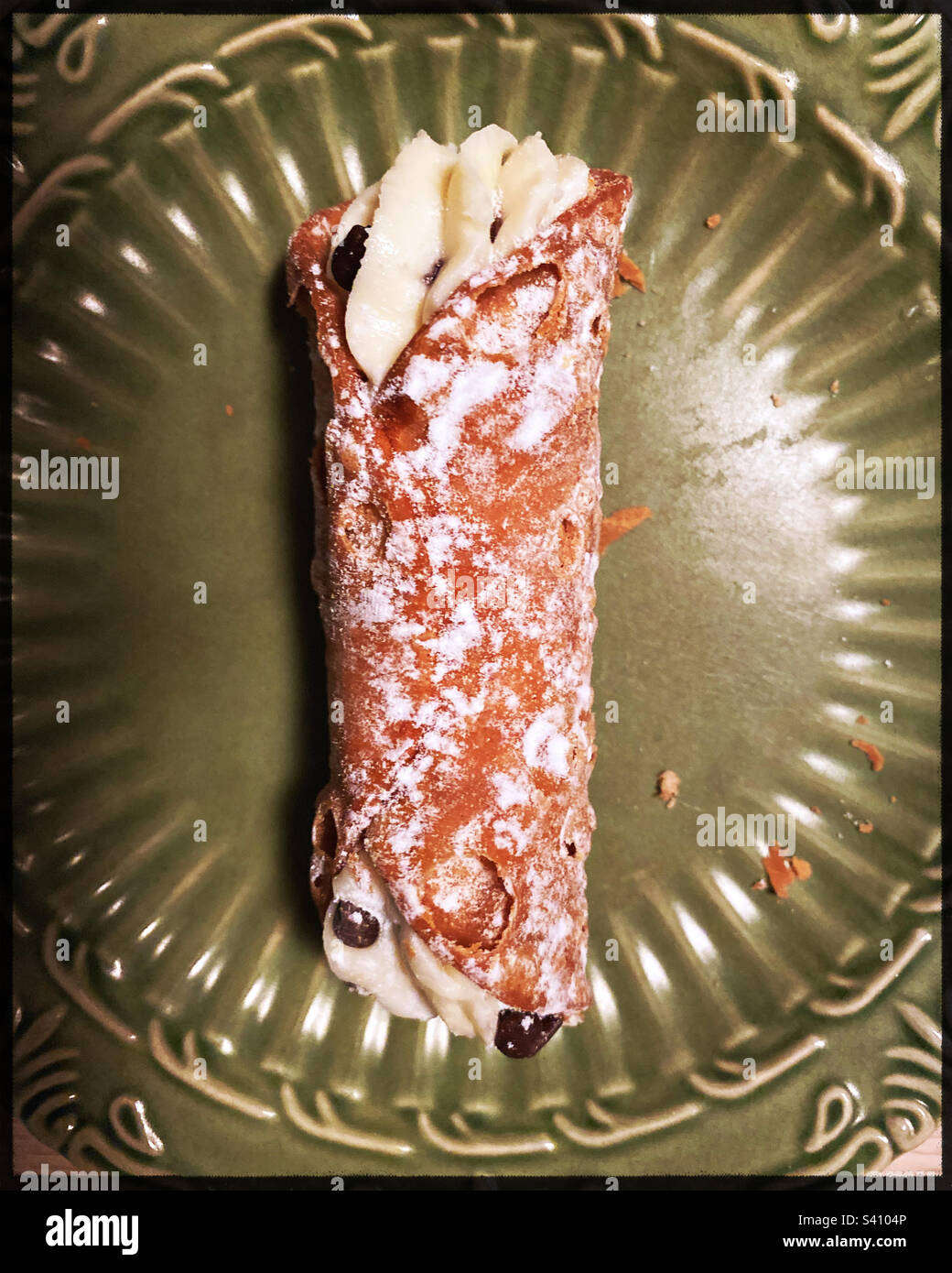 Cheese cannoli on green plate Stock Photo - Alamy