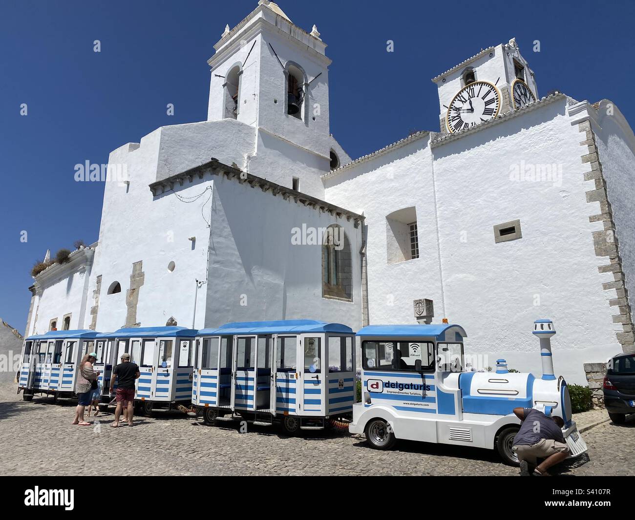 Tavira tourist train outside of the church in Tavira, Portugal Stock ...