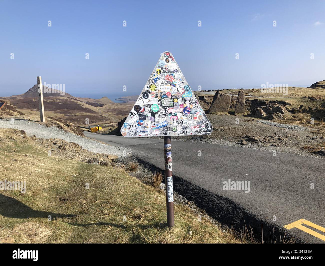 Overtourism issues - road sign covered in stickers at the Quiraing ...