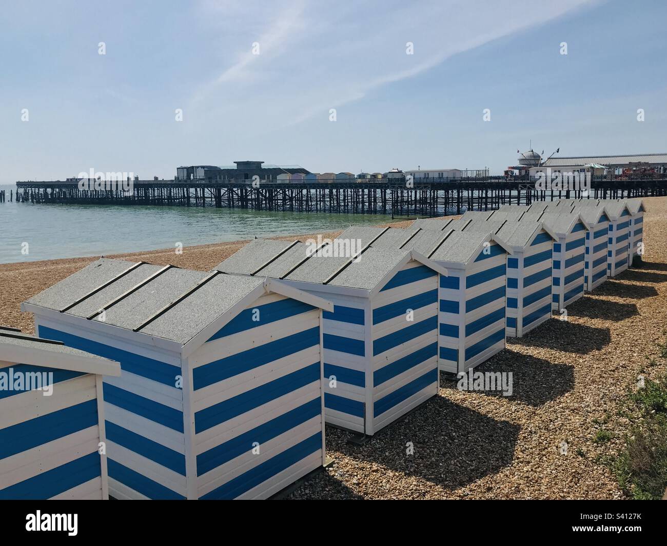 Stripy blue beach huts hi-res stock photography and images - Alamy