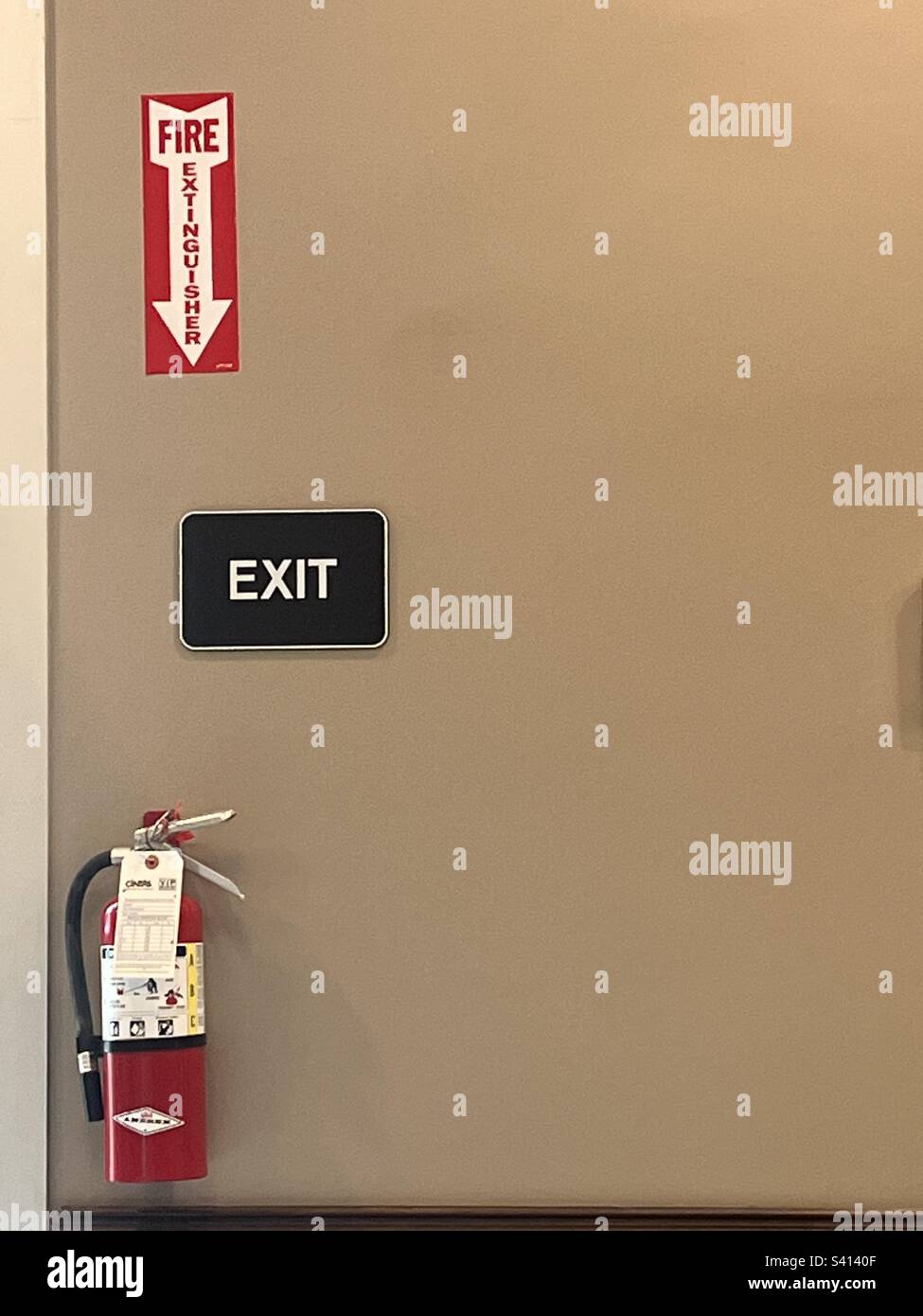Fire extinguisher and Exit sign Stock Photo - Alamy