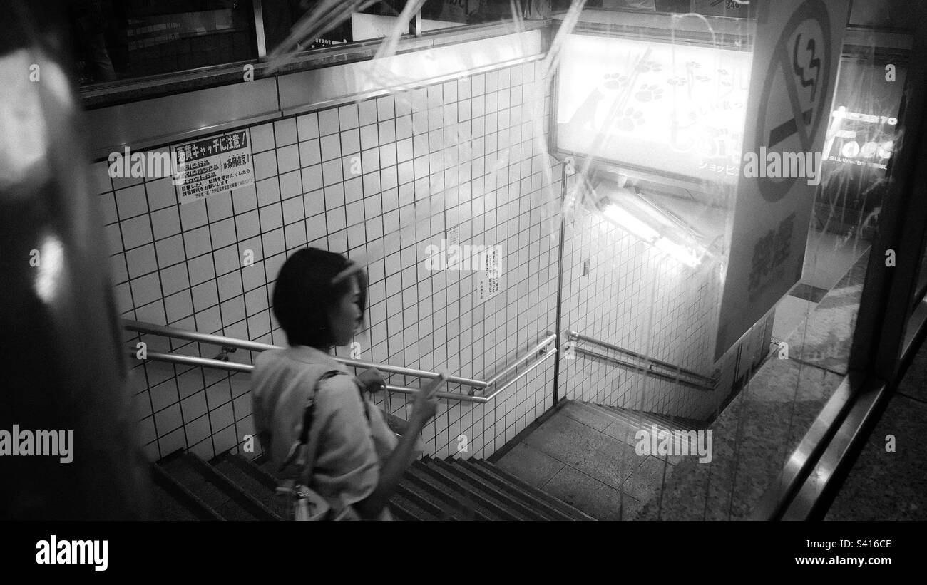 Girl at subway in tokyo hi-res stock photography and images - Alamy