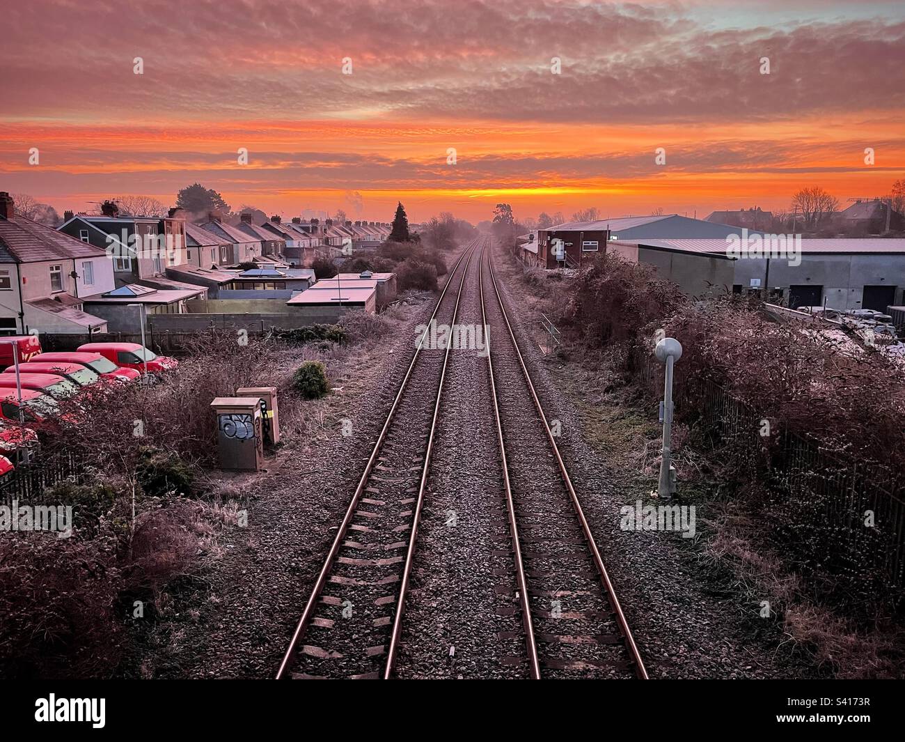 Railway lines leading into the distance on a cold frosty morning in ...