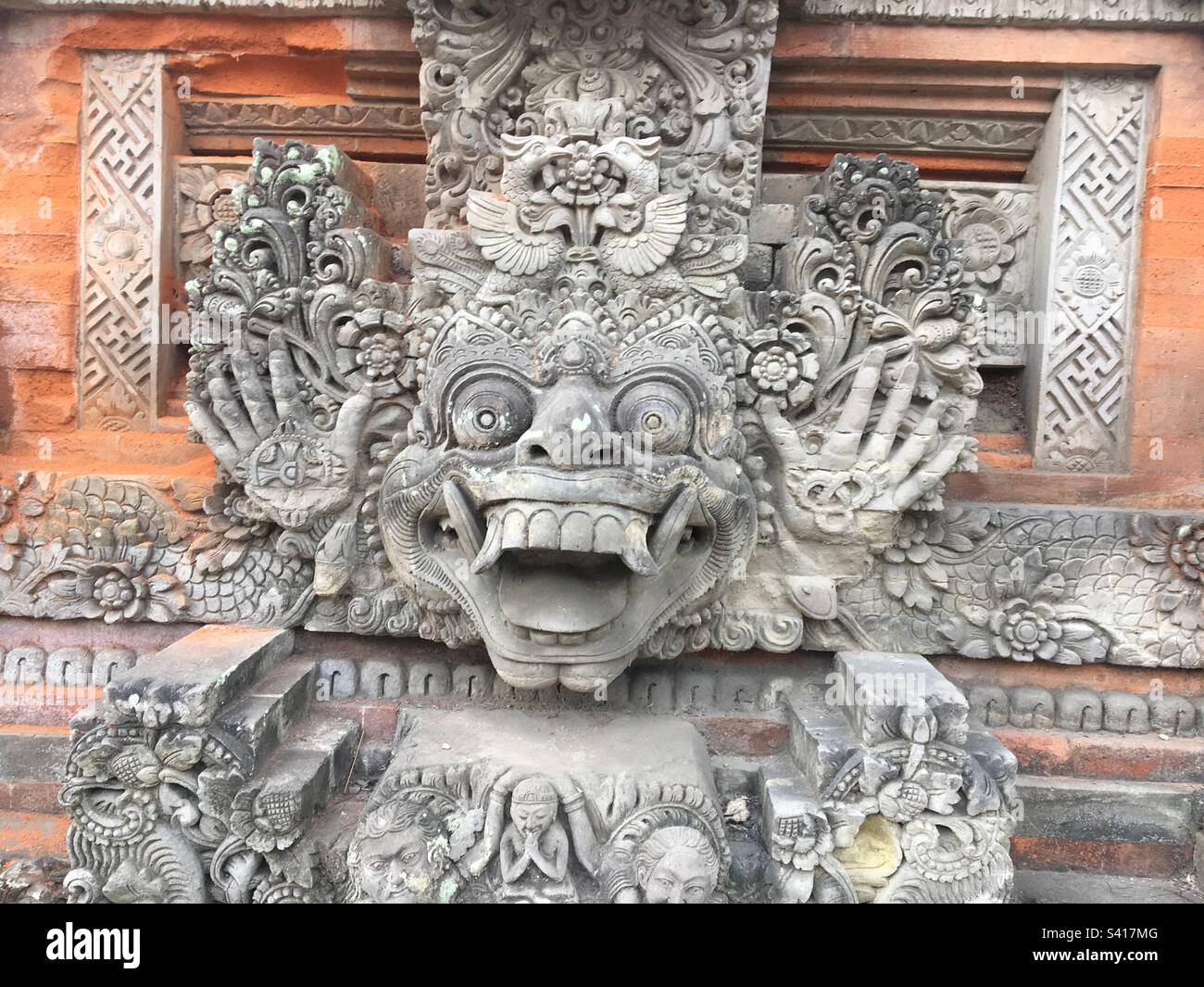 Evil spirit in Bali with raised hands Stock Photo - Alamy