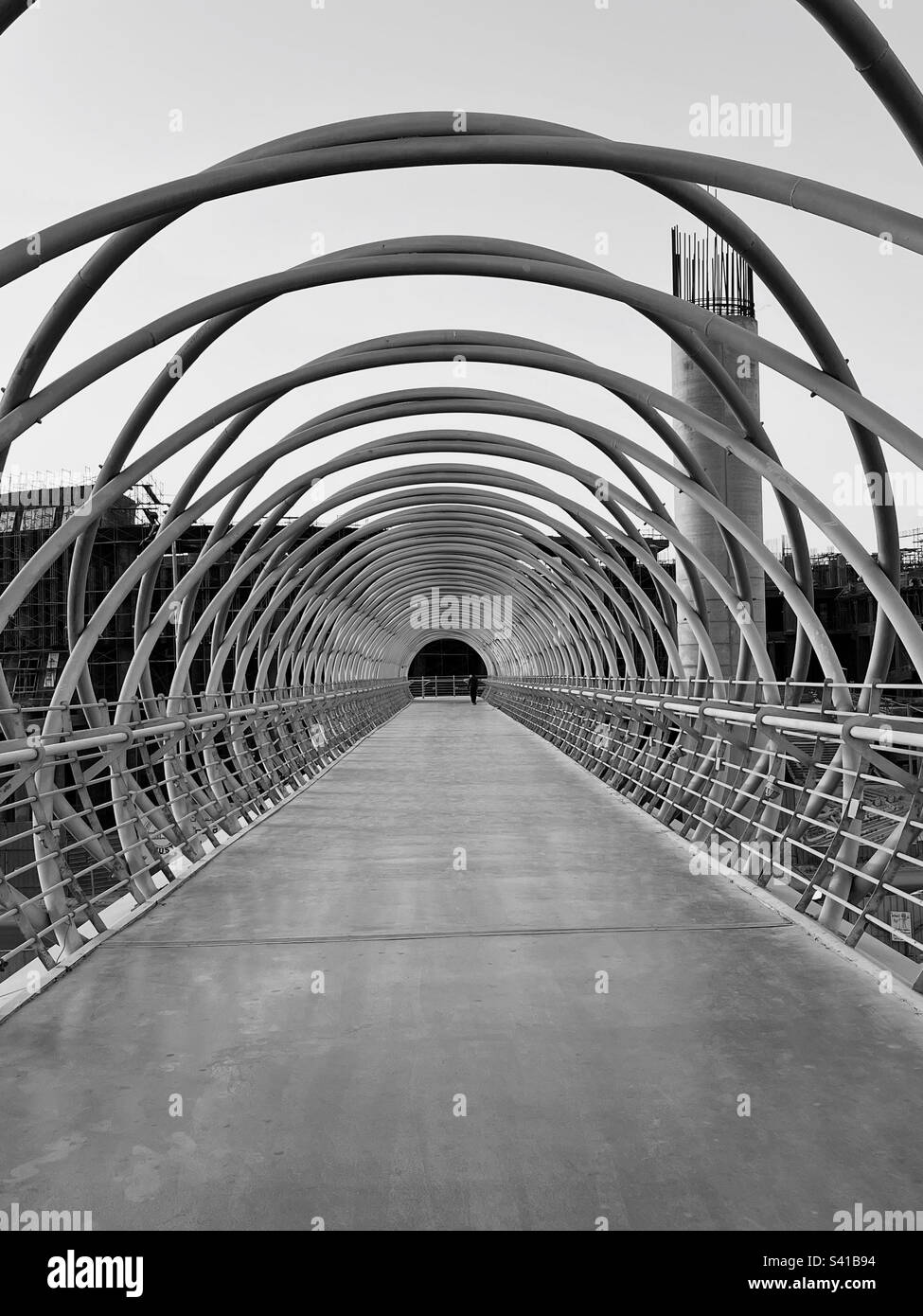 1st person view walking across a pedestrian bridge with intersecting ...