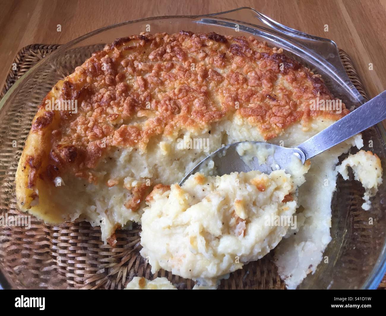 Mashed potatoes with serving spoon presenting creamy white mash hi-res ...