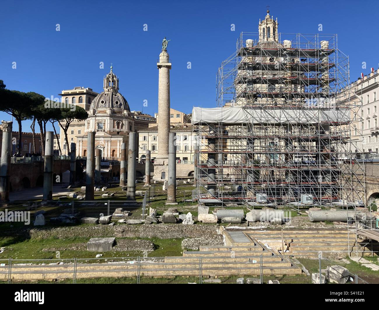 Columns of the Basilica Ulpia being erected next to the column of ...