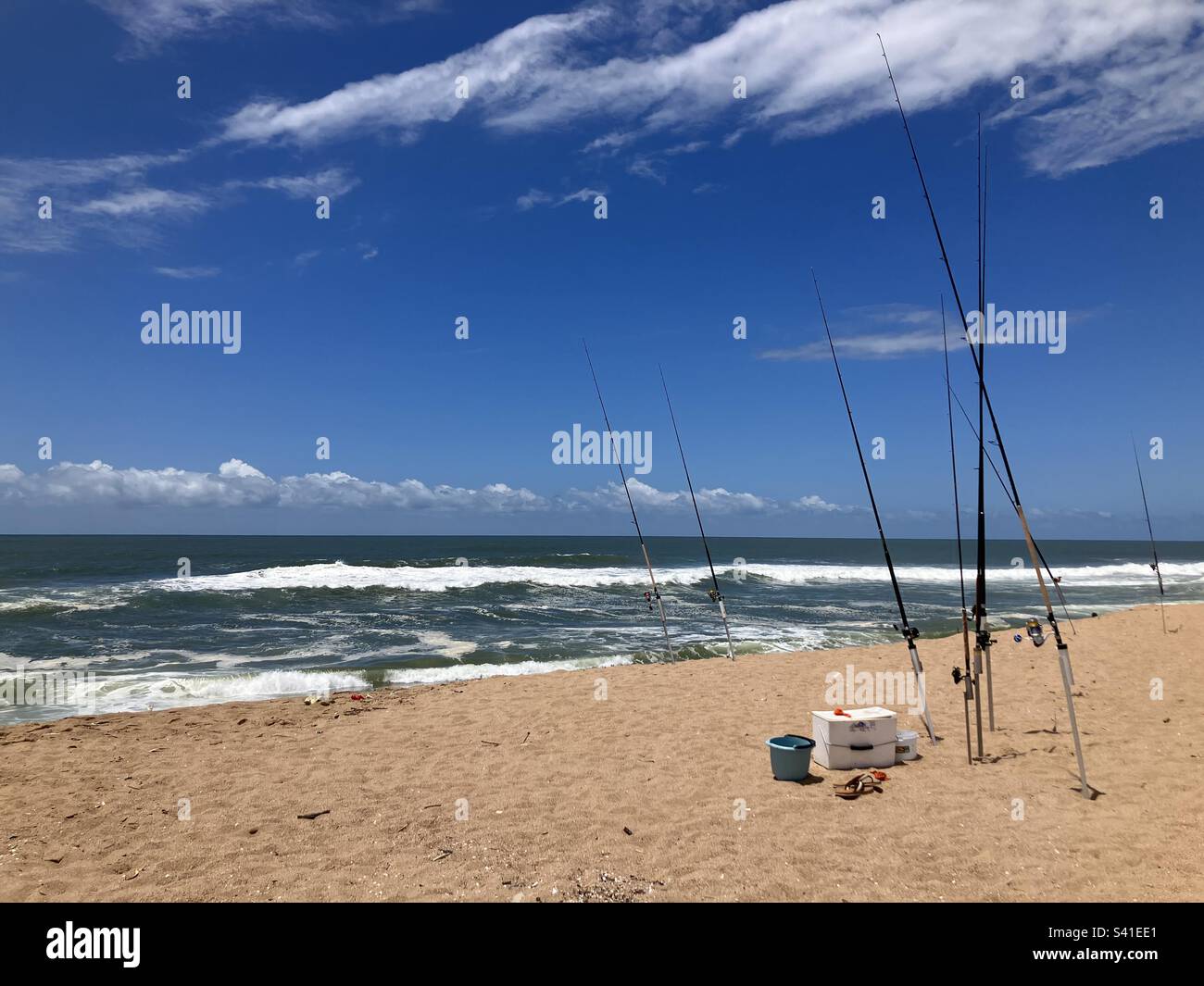 Fishing on beach Stock Photo - Alamy