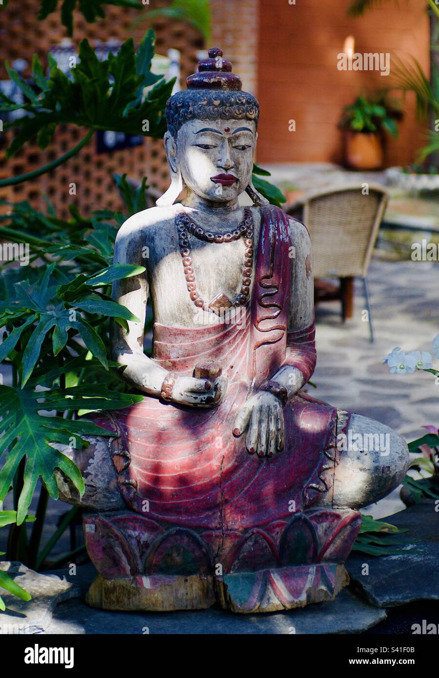 Buddha statue in a peaceful setting Stock Photo - Alamy