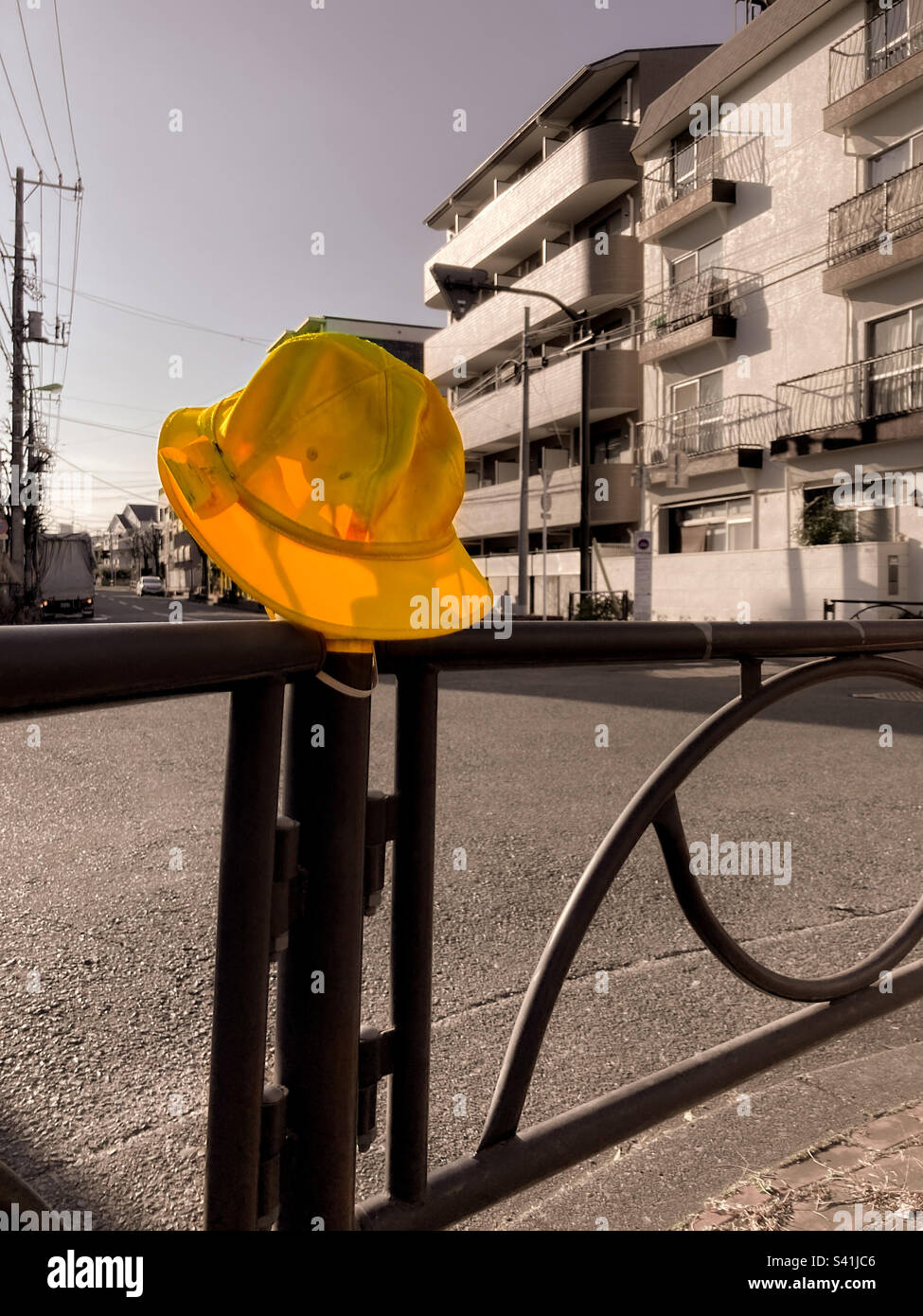 The lost hat - a yellow bucket hat, usually worn by Japanese elementary ...