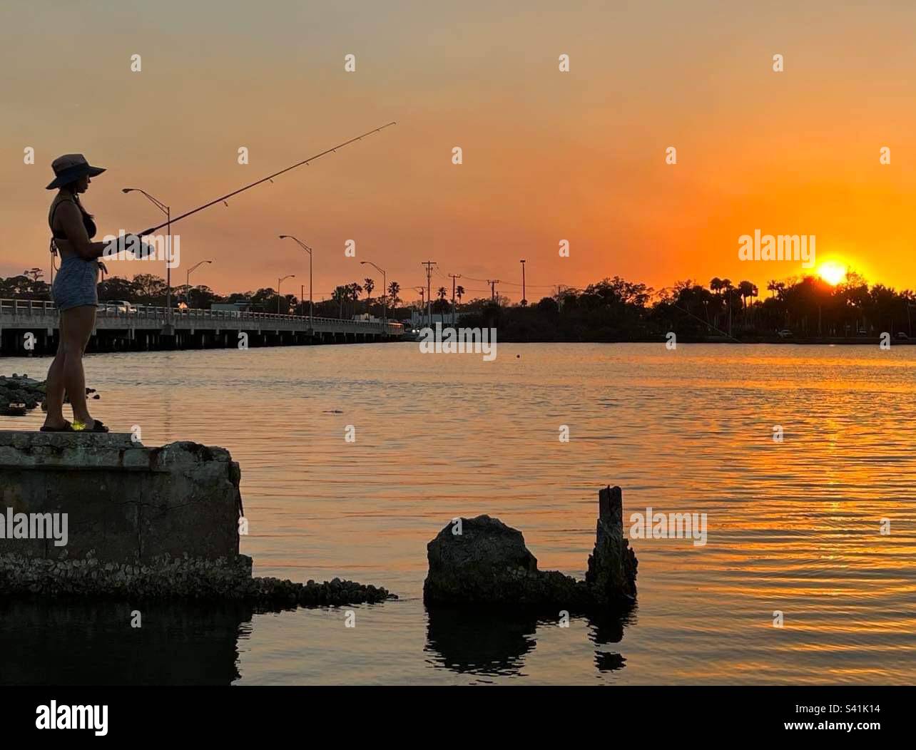 Lady fishing hi-res stock photography and images - Alamy