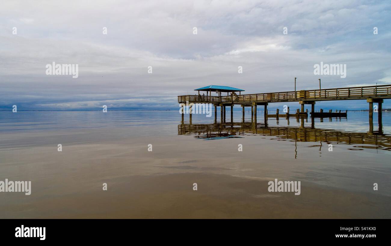Pier on Mobile Bay at sunset Stock Photo - Alamy