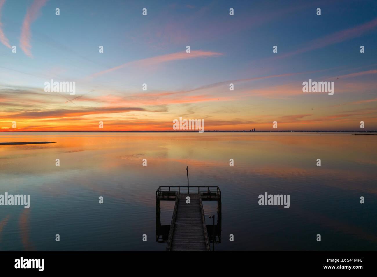 Aerial view of a pier at sunset on the eastern shore of Mobile Bay ...