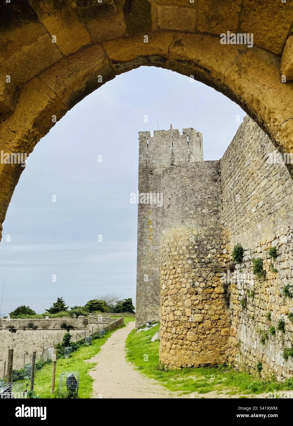 View of castle tower through arch Stock Photo - Alamy