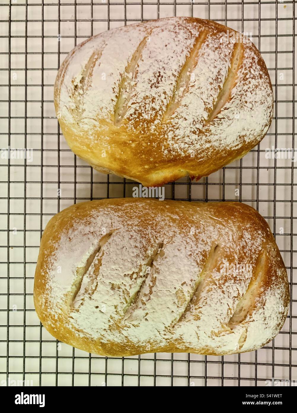 Homemade bread on a cooling rack Stock Photo - Alamy