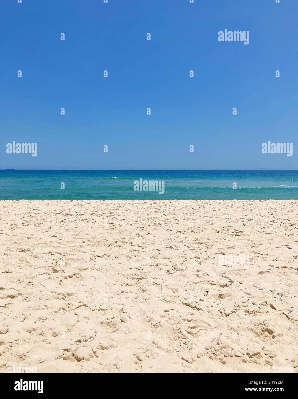 Beach water blue green sand clear horizon line blue sky sea Stock Photo ...
