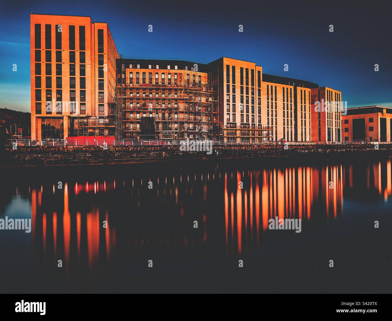 Reflections of buildings in the river Tawe at Swansea Marina Stock ...