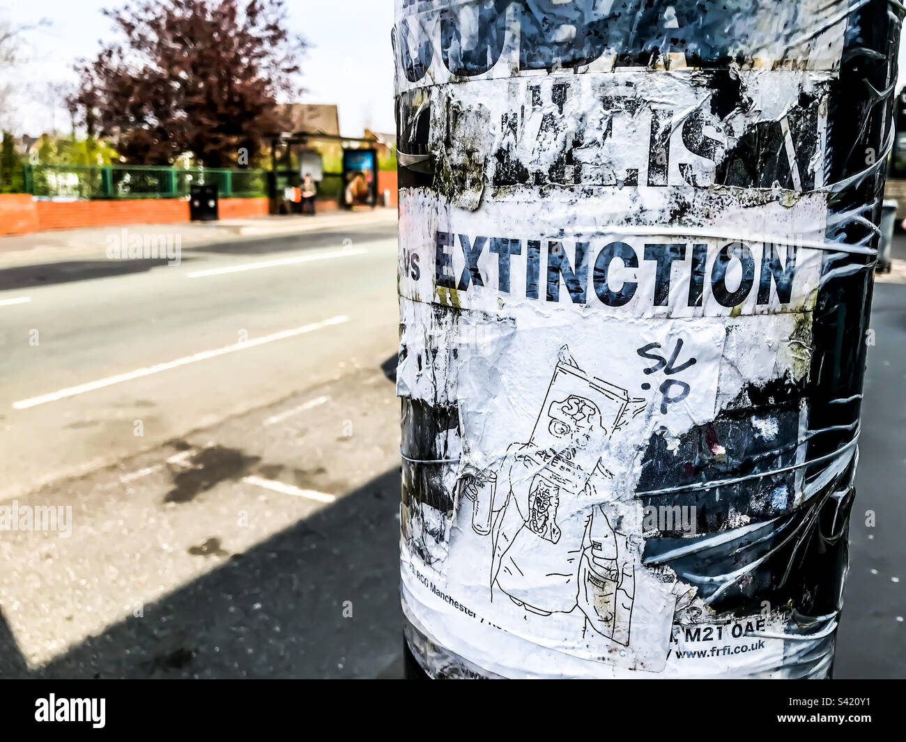 Extinction poster on a lamppost Stock Photo - Alamy