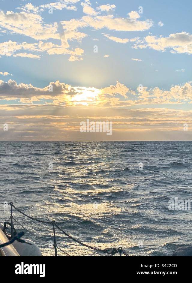 Sunset over ocean Stock Photo - Alamy