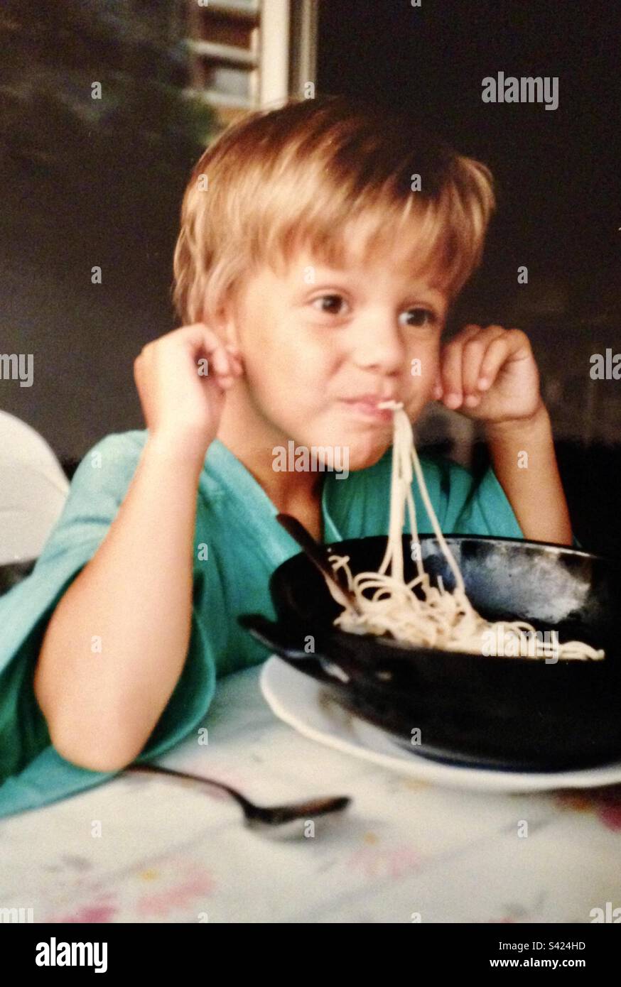 Nursery school age, boy, having fun on holiday, winding his ears for ...
