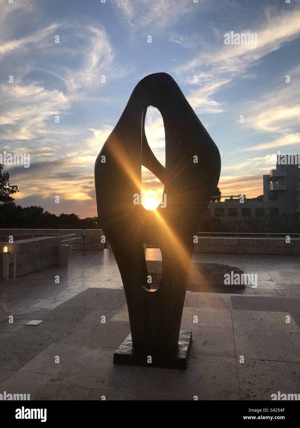 The setting sun peaks through Figure for Landscape, by Barbara Hepworth ...