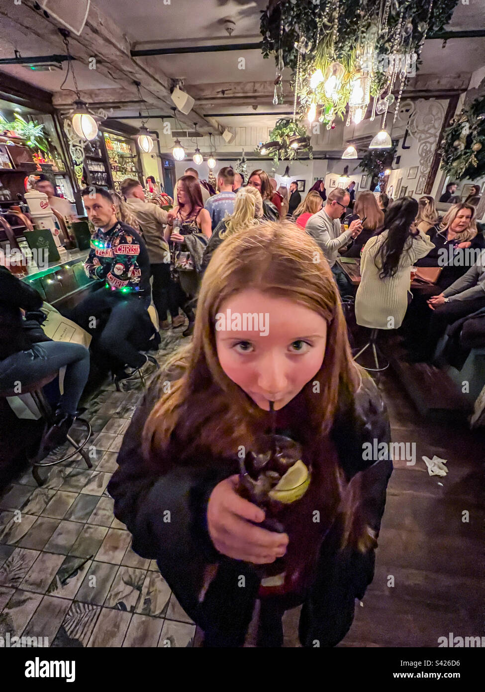 Teenager drinking cola in bar Stock Photo - Alamy