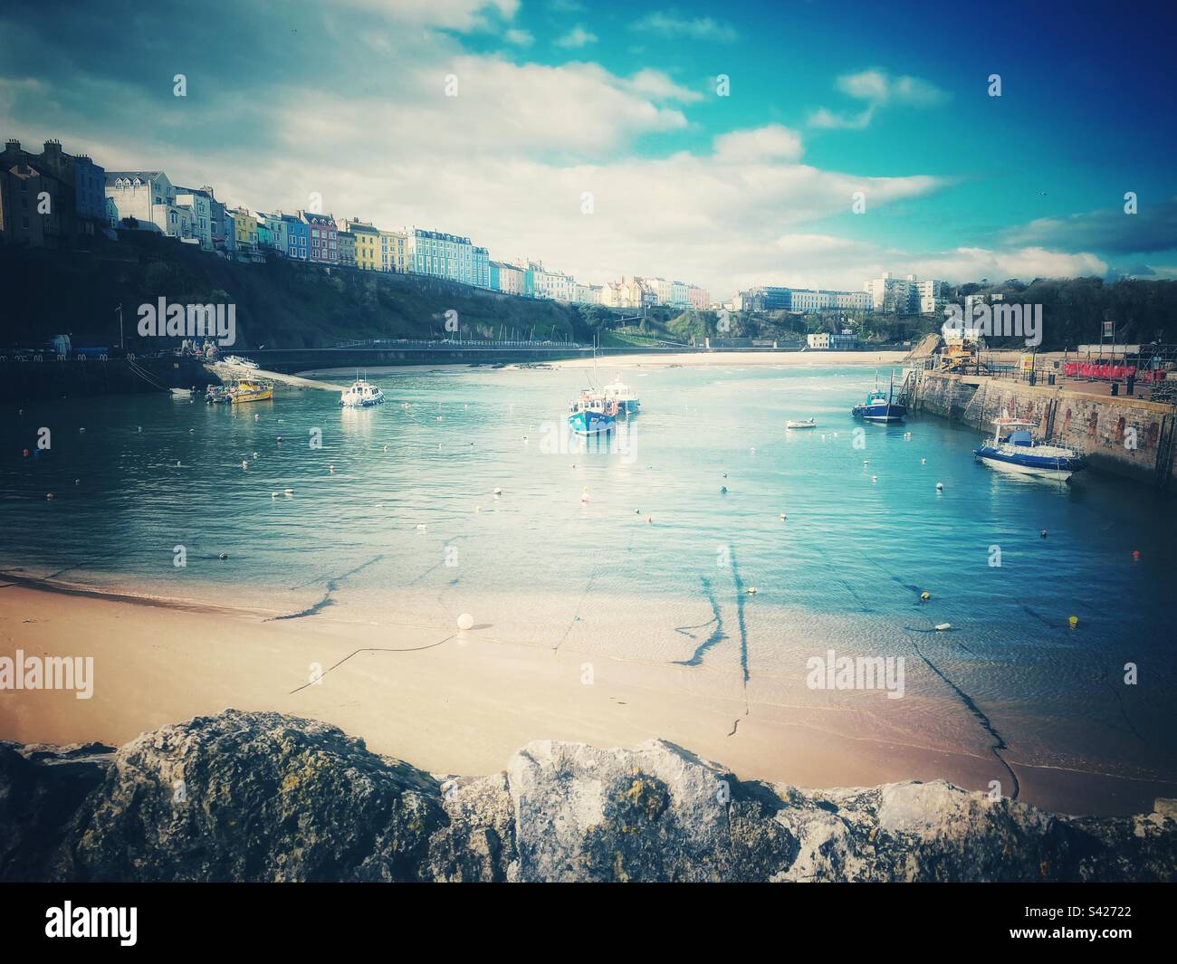 A photograph of Tenby harbour at high tide on a beautiful sunny day ...