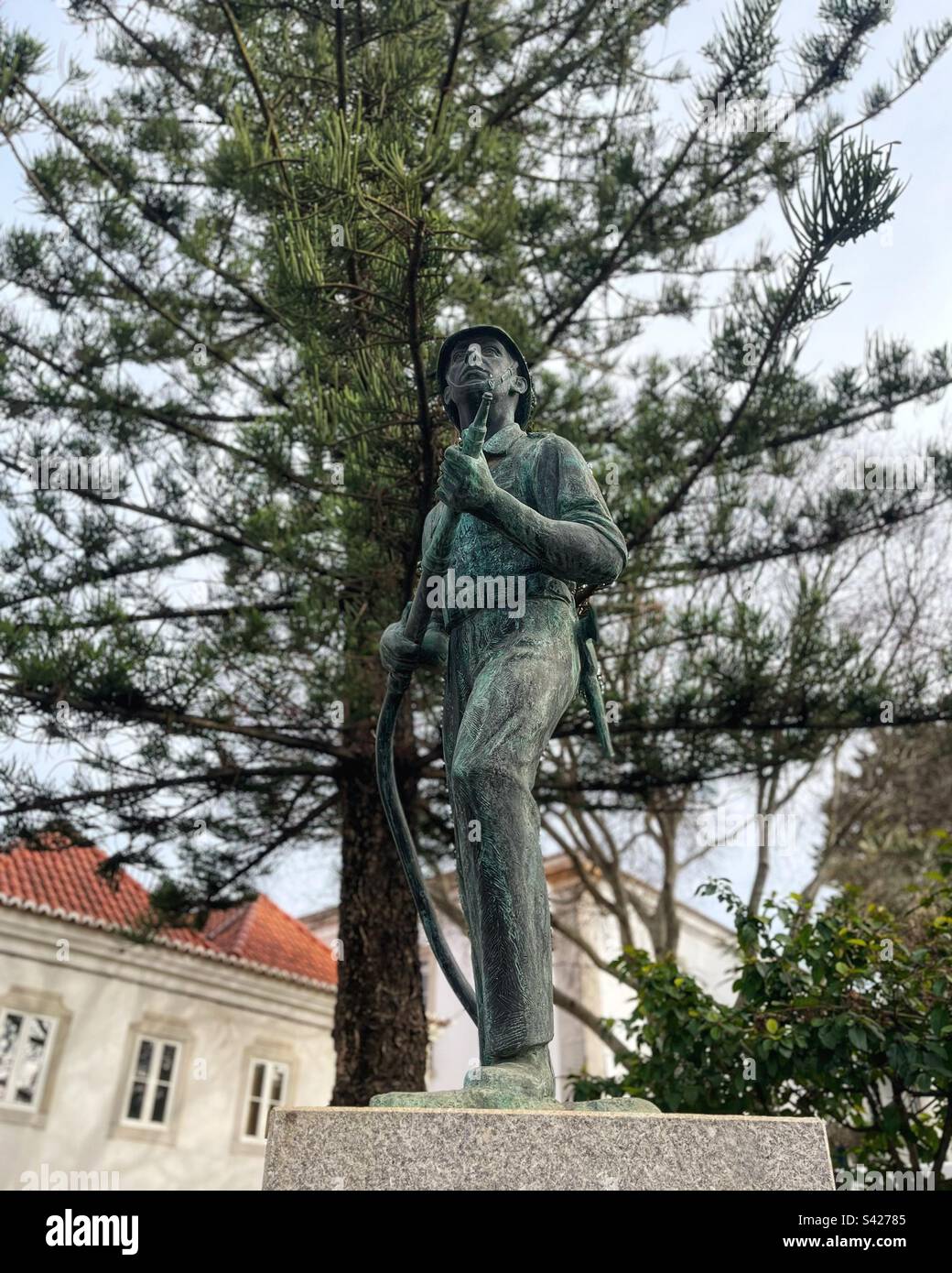 Statue of a fire fighter opposite the fire station in Tavira in ...