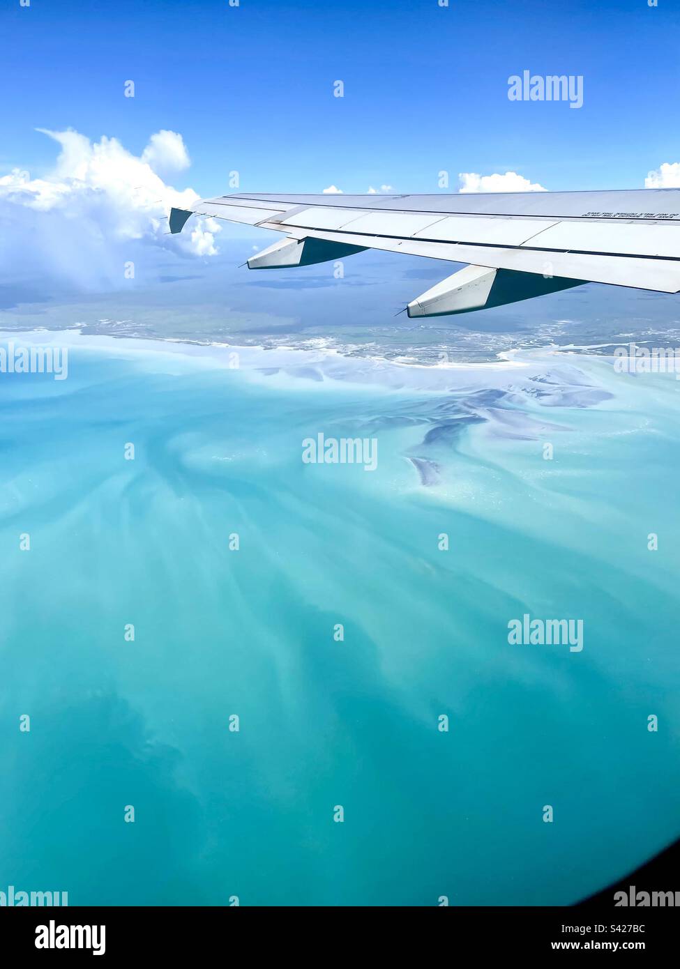 Blue tidal ocean from the airplane window Stock Photo - Alamy