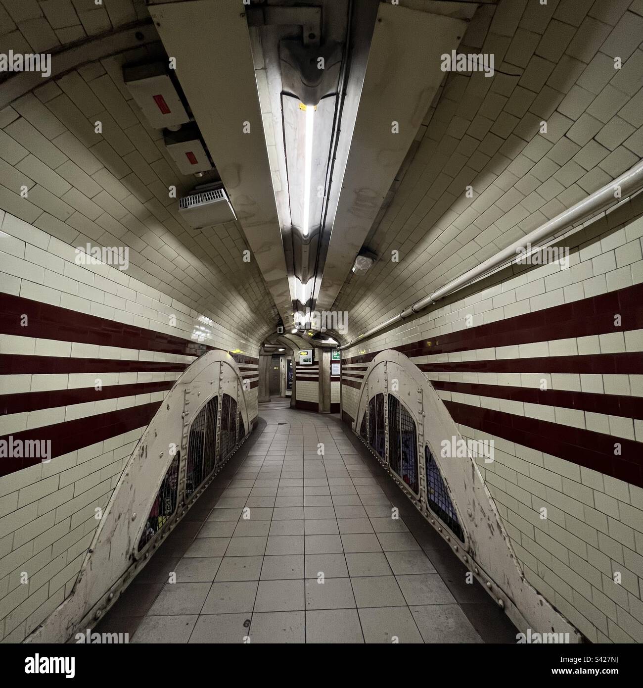 Hampstead Underground station corridor with original tiles Stock Photo ...