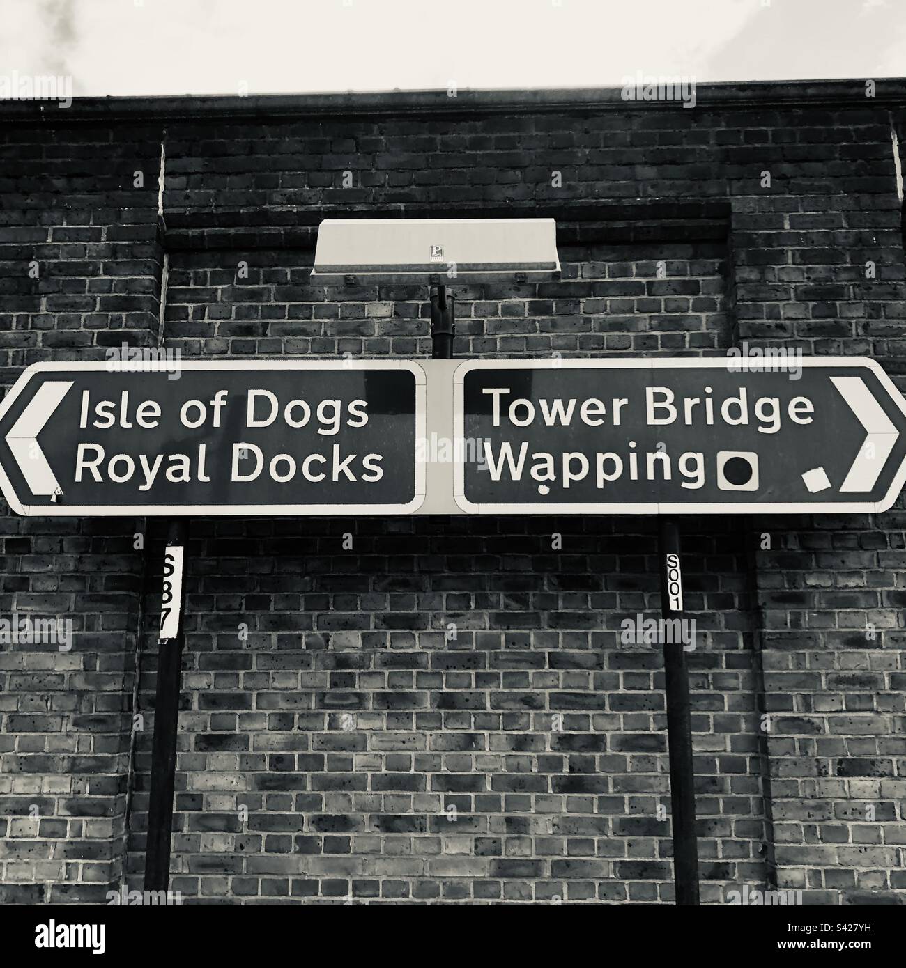 Signs pointing to Tower Bridge Wapping and Isle of Dogs Royal Docks ...