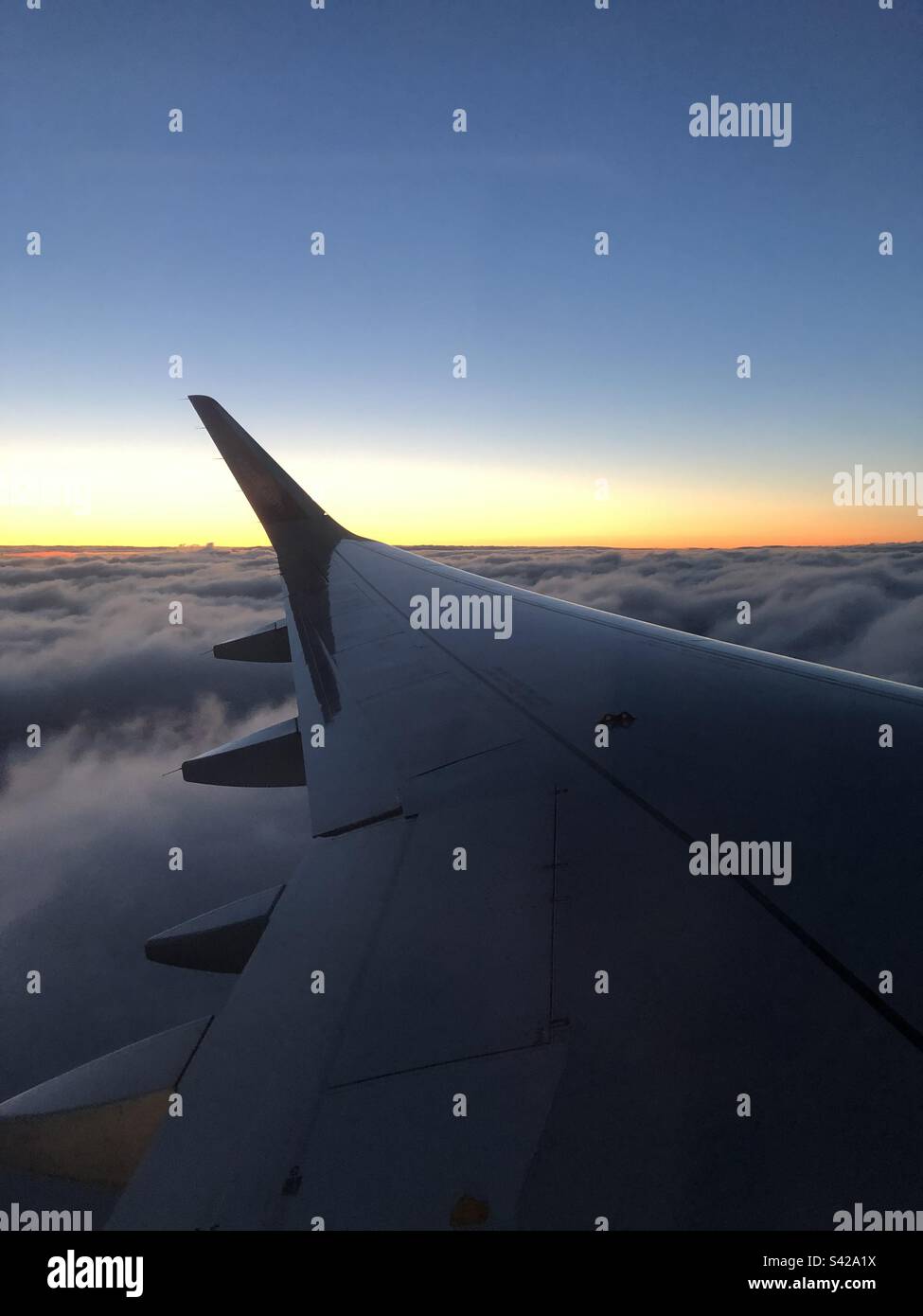 Airplane and clouds hi-res stock photography and images - Alamy