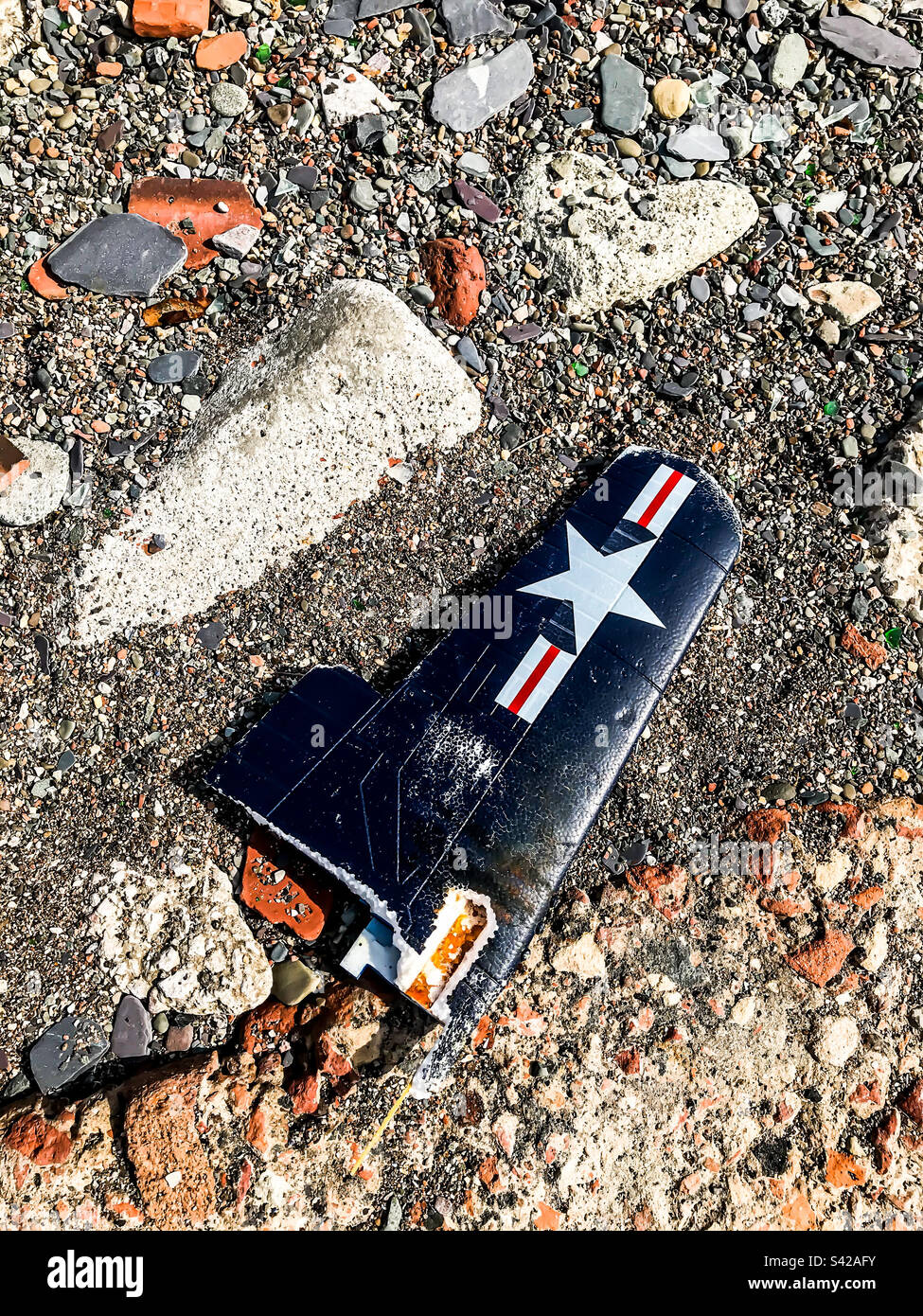 Wing of a model aeroplane on Blitz beach Stock Photo - Alamy