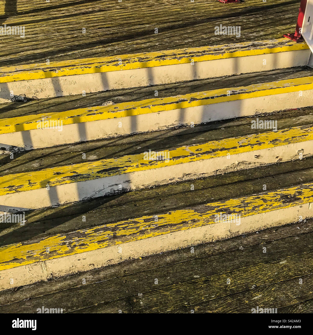 Yellow painted wooden steps Stock Photo - Alamy