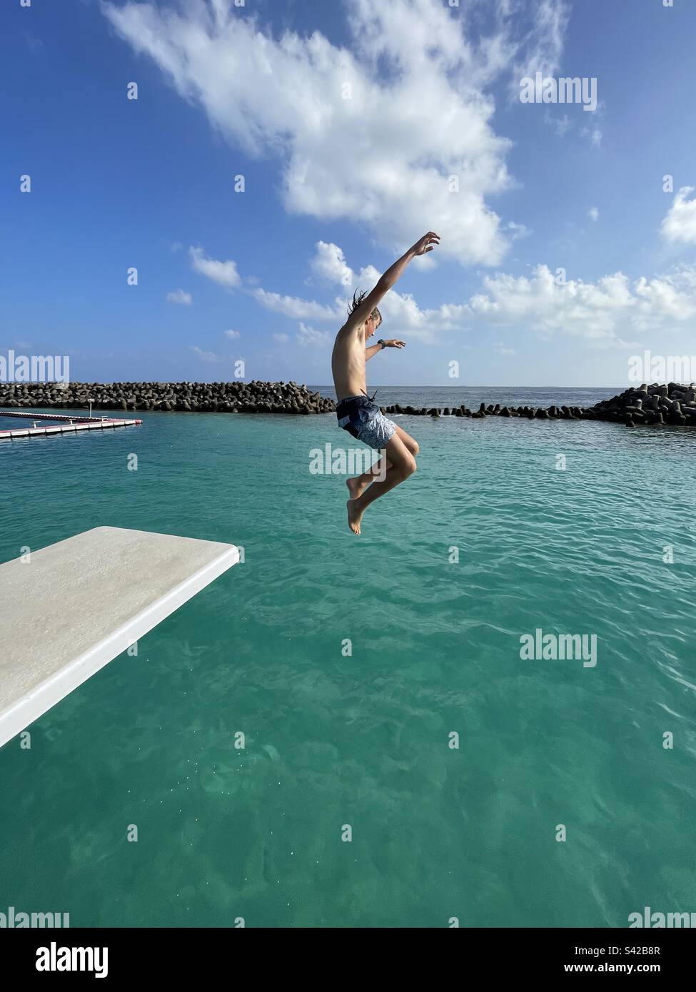 Boy dive board hi-res stock photography and images - Alamy