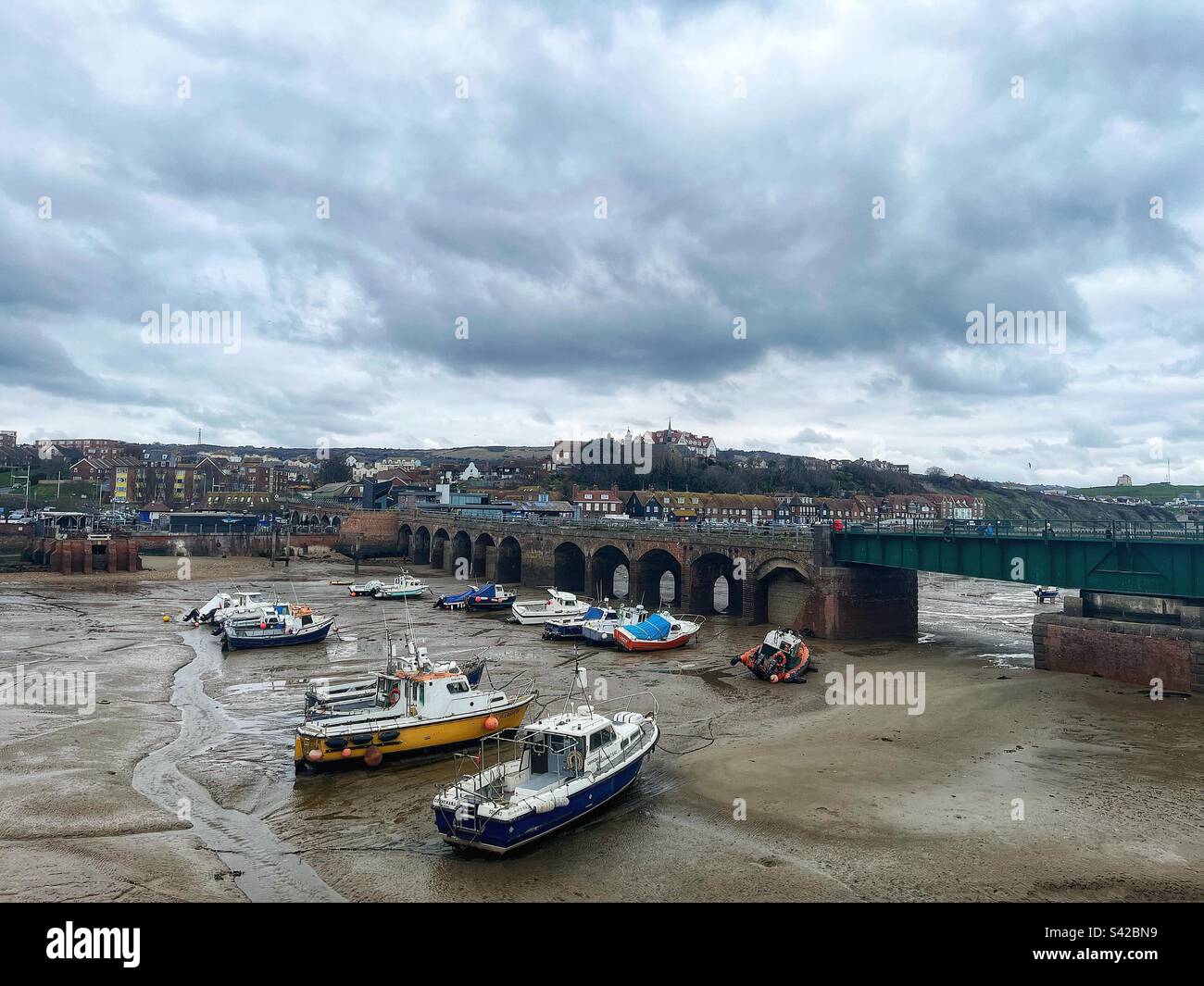 The railway viaduct crosses the harbour at Folkestone in Kent. Seen at ...