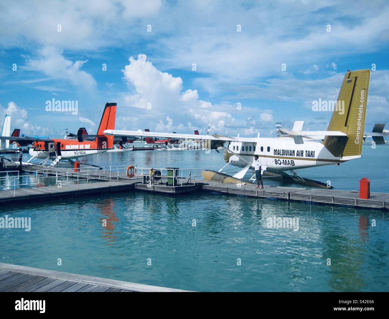 Seaplanes wait to leave the capital of the Maldives, Male, heading ...