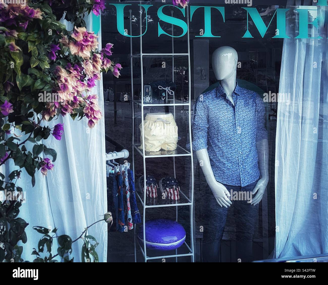 Just Me on a shop window with male clothes and manikin Stock Photo - Alamy