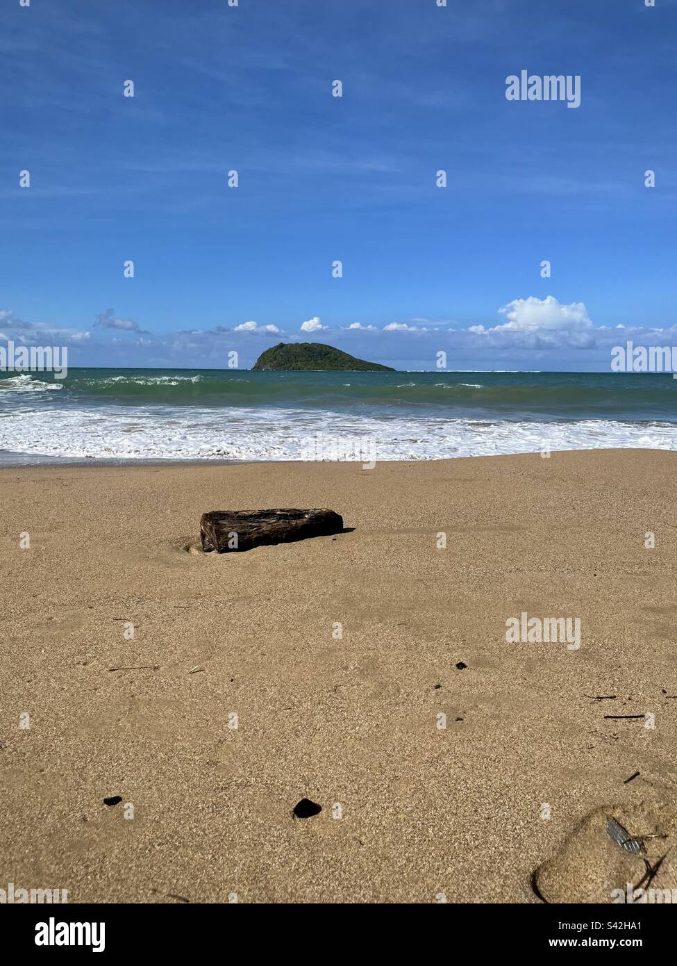 Sandy beach in the Caribbean with a view of an island. Photo taken in ...