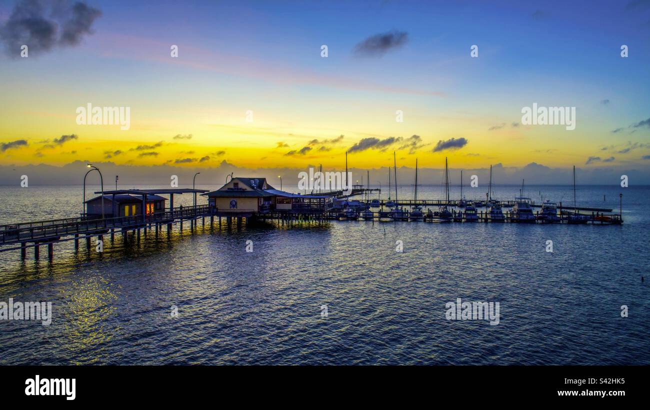 Pier at sunset Stock Photo - Alamy