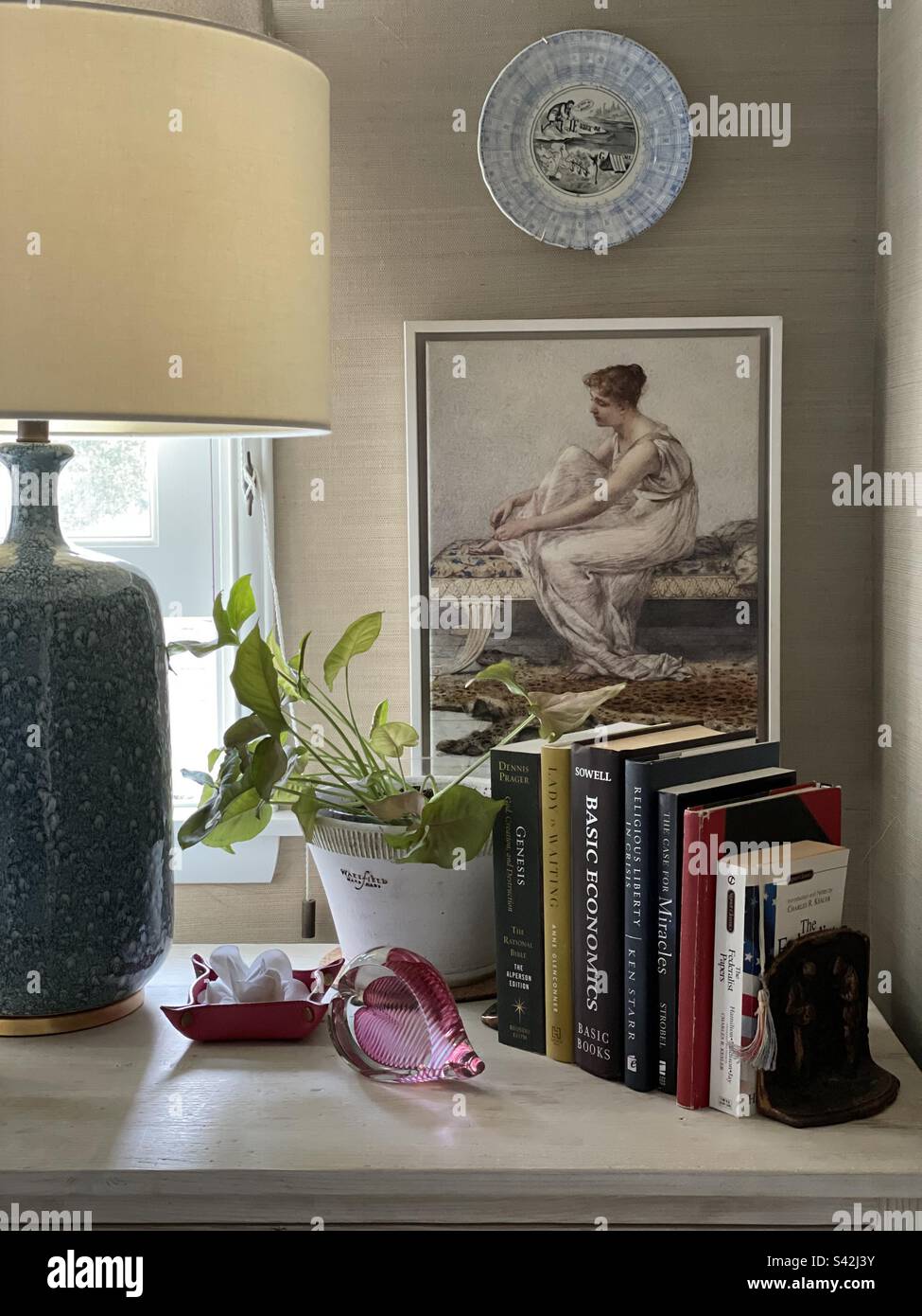 Vignette of a table top with books and artwork Stock Photo - Alamy