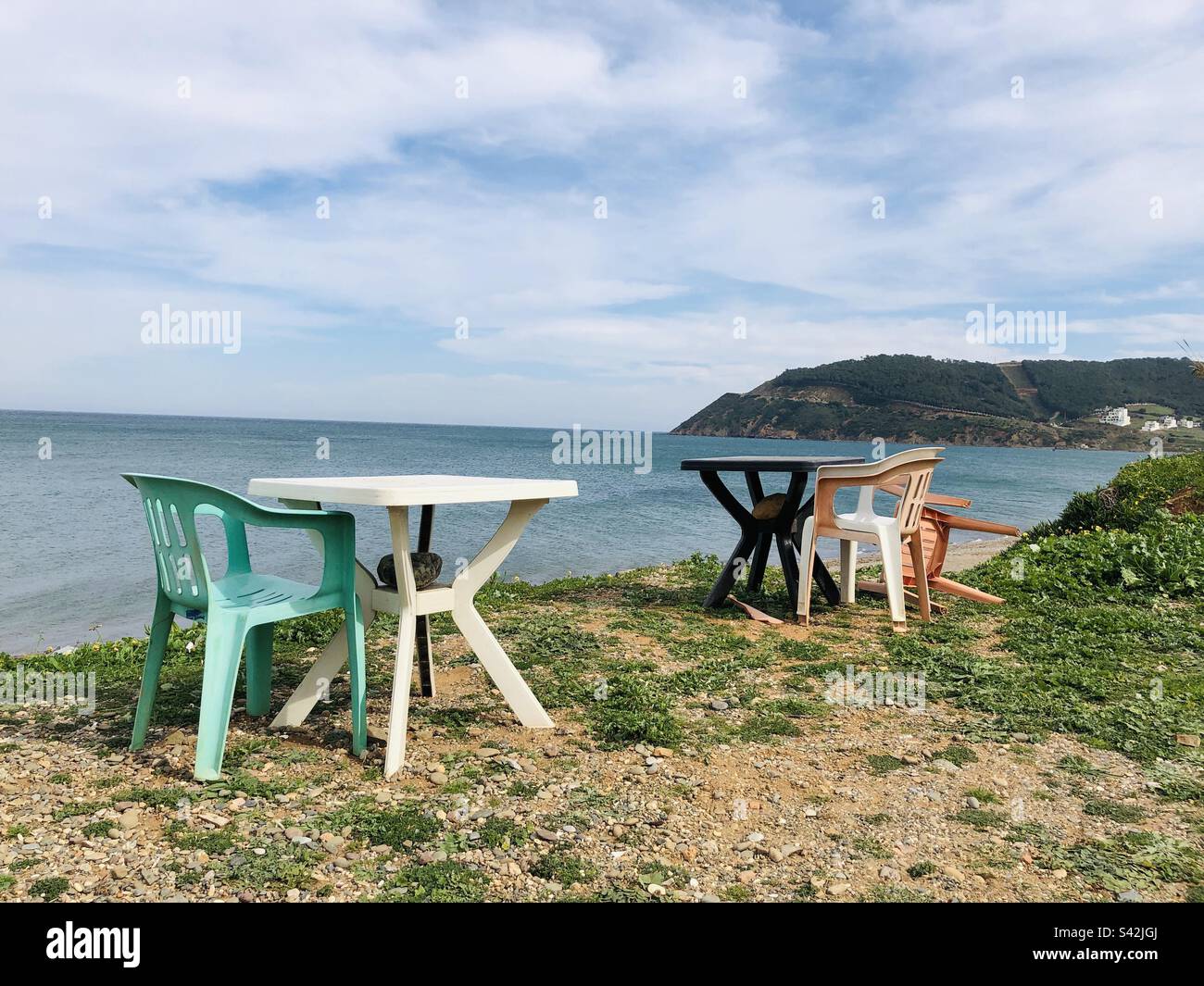 Monobloc chair at the beach Stock Photo - Alamy