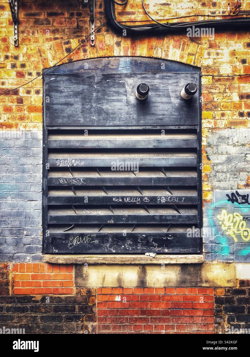 Patched up Brickwork in back alley Stock Photo - Alamy