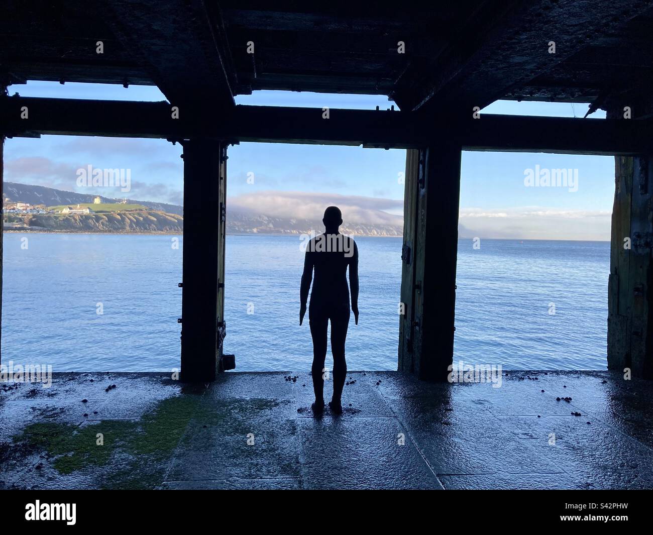 Antony Gormley figure staring out to sea in Folkestone, Kent Stock ...