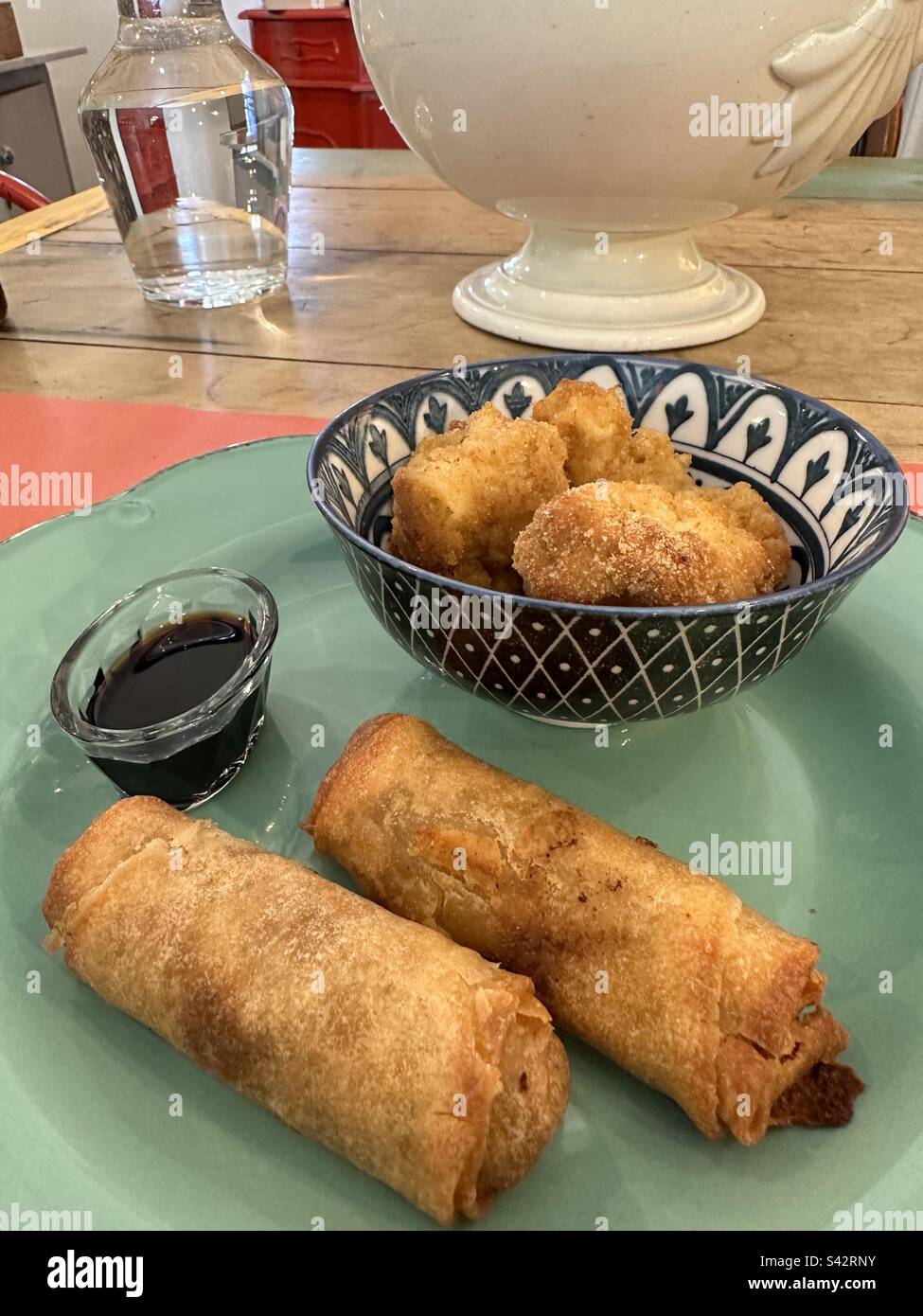 Bio lunch with organic spring rolls, baked cauliflower and soia sausage ...