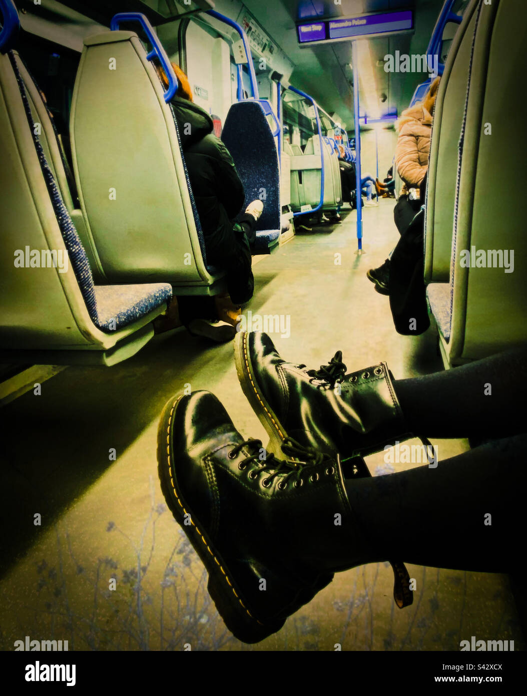 A pair of boots in the aisle of a train in the UK Stock Photo - Alamy