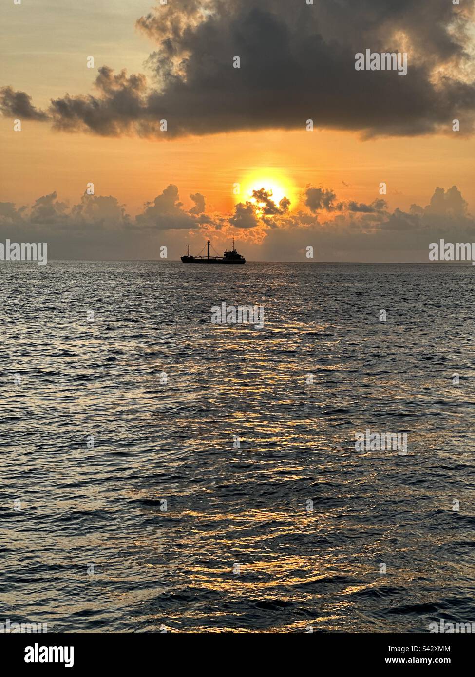 Ship and the sunset Stock Photo - Alamy