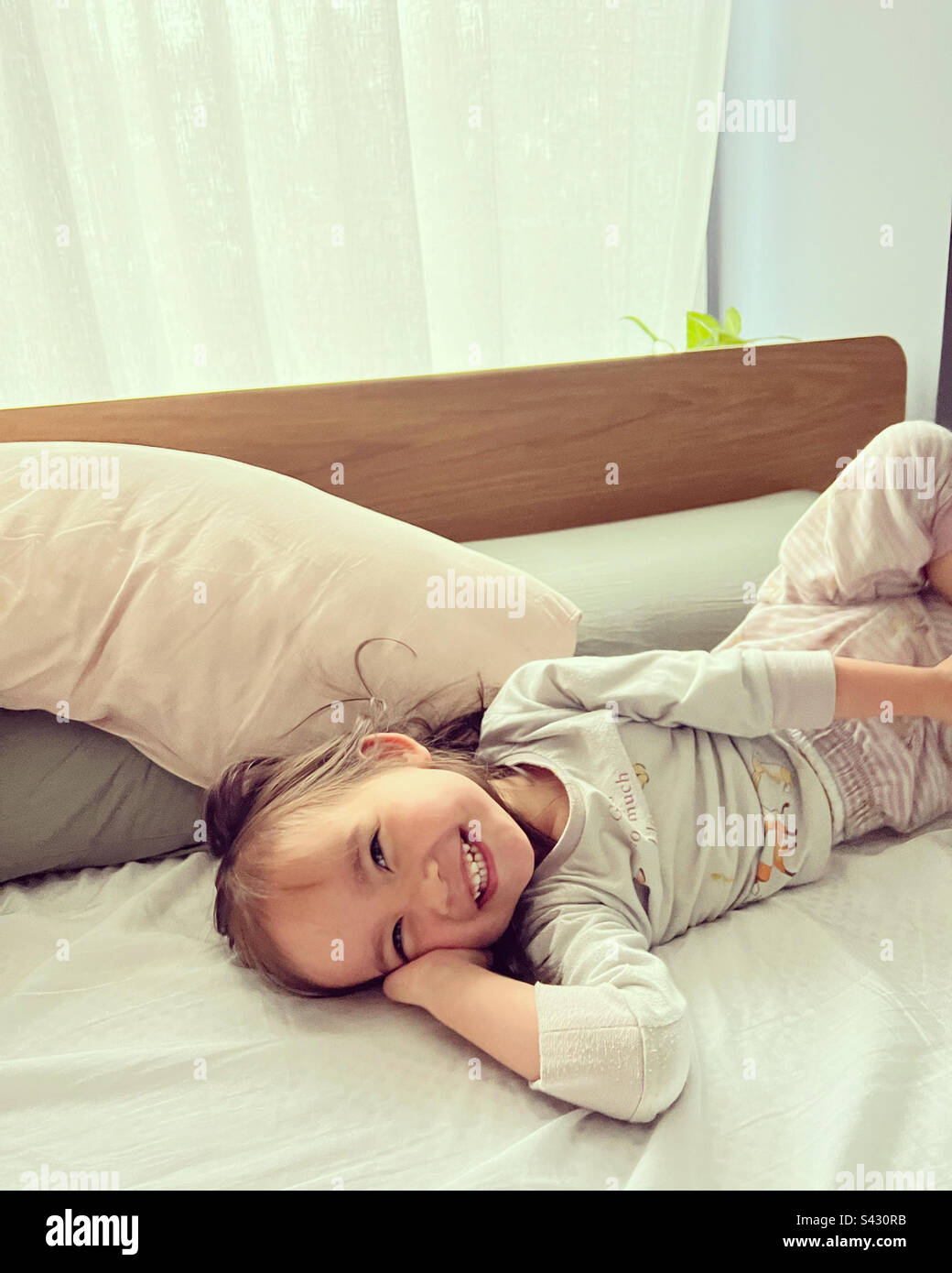 Happy child on bed Stock Photo - Alamy